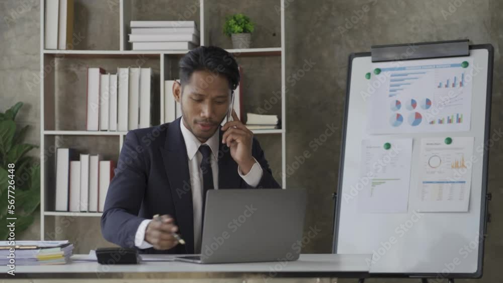 Businessman using company laptop to report on business strategy ...