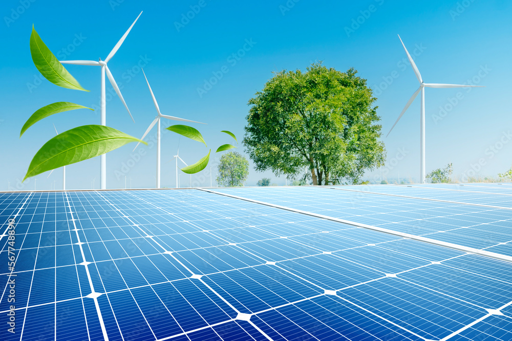 wind turbine and solar panel, green leaf blowing in sky. renewable ...