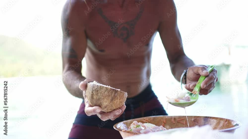 traditional man in Tahiti making poisson cru dish. Polynesian island ...