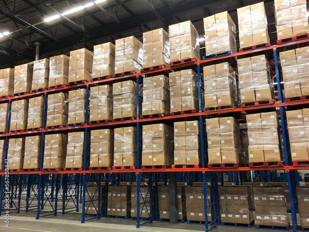 Pallets of boxes of paper towels stacked in distribution center. Stock ...