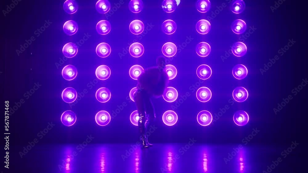 Slim fit active woman dancing RnB style moves, spinning on floor ...