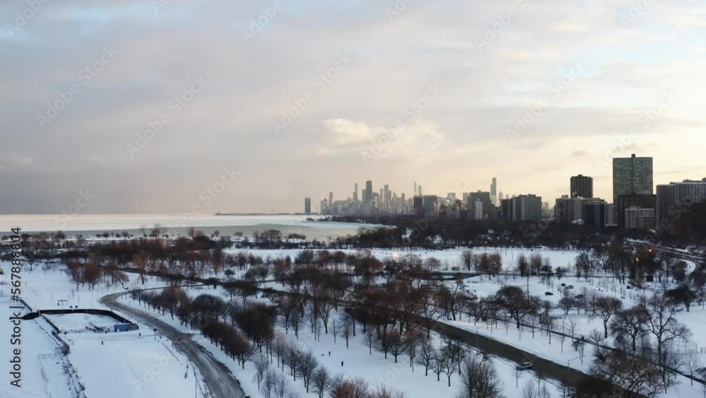 Aerial winter scenes flying above Montrose beach and Cricket Hill with ...