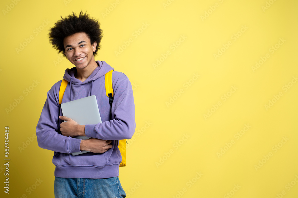 Confident smiling African American student holding laptop isolated on ...