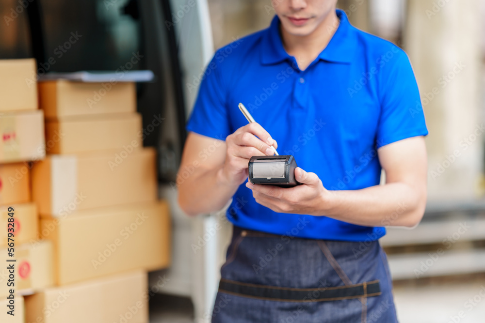 Delivery man asia people checking portable delivery device with parcel ...