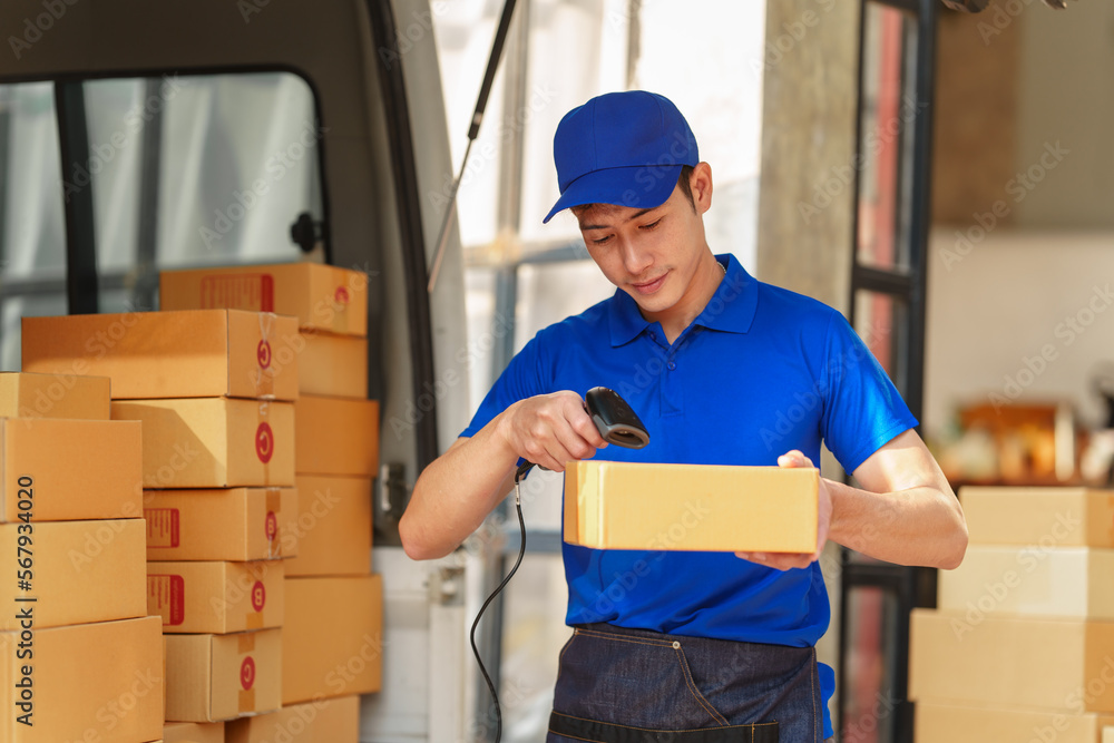 Delivery man asia people checking portable delivery device with parcel ...