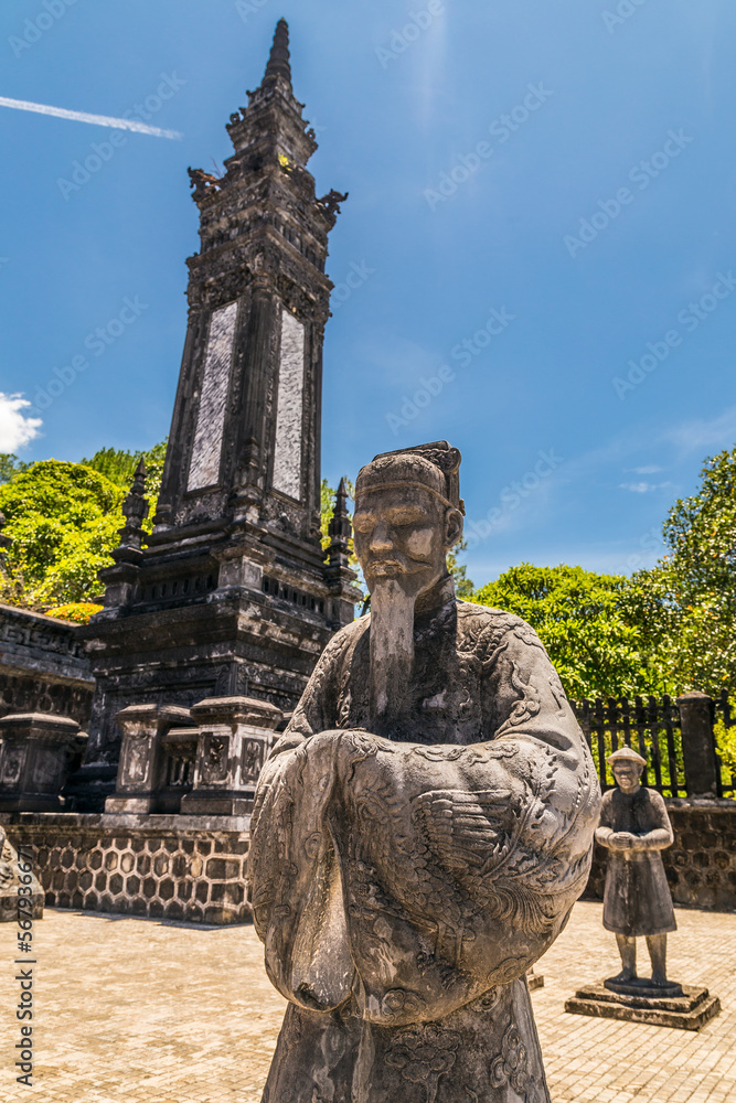 Fotografia do Stock: Ancient stone statues standing at the base of a ...