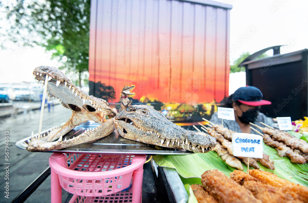 Crocodile heads on display at a food stall in Bangkok,Thailand. Stock ...