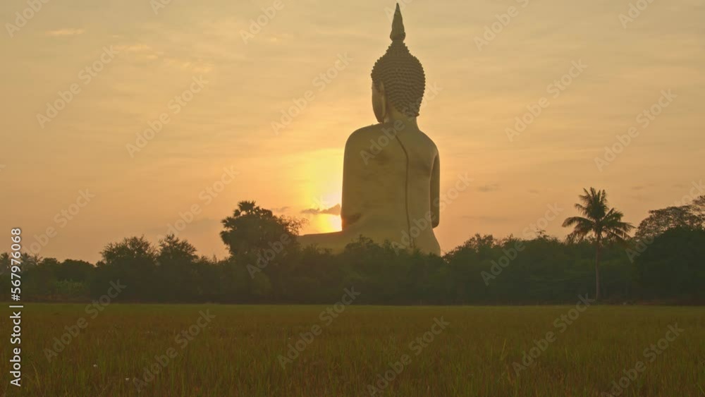 scenery sunrise in front of the great Buddha of Thailand at wat Muang ...