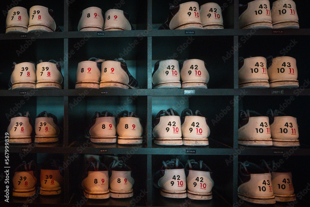 Shadowed cubbies of retro bowling shoes Stock Photo | Adobe Stock