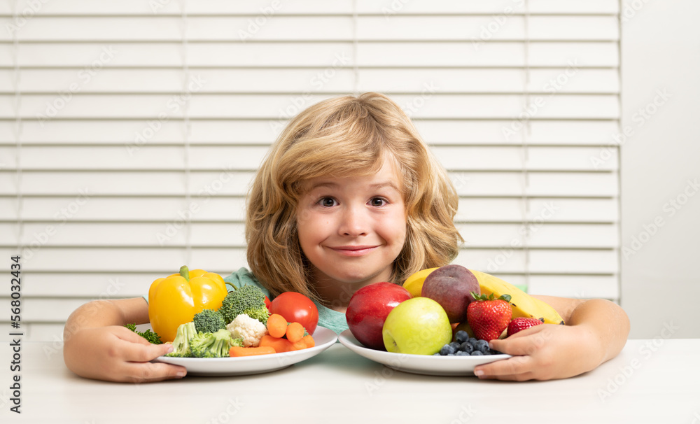 Fruits and vegetables. Kid boy eating healthy food vegetables ...