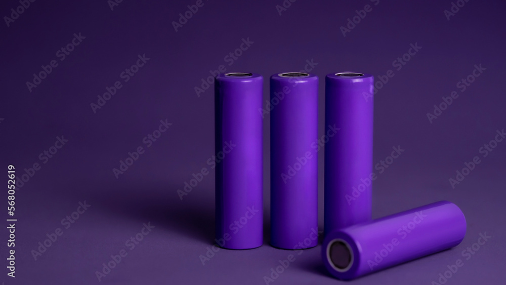 Battery. Cylindrical battery, type 18650 on a purple background ...