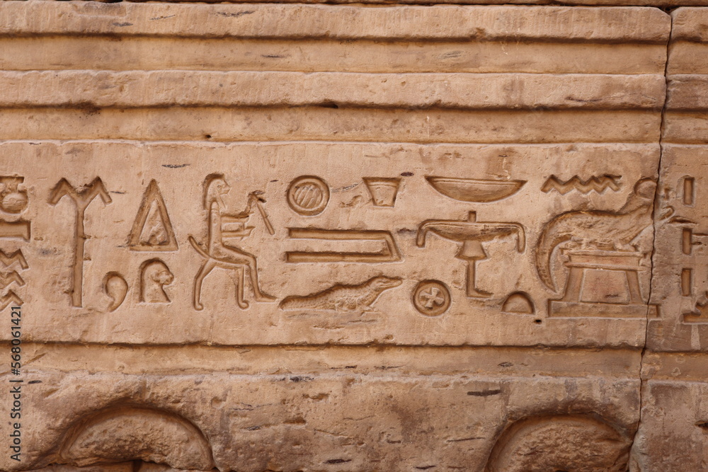 Ancient egyptian hieroglyphs at the walls of Kom Ombo in Aswan, Egypt ...