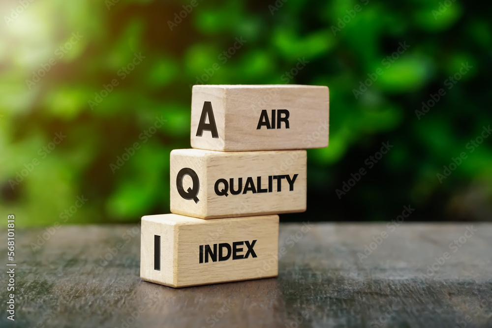 AQI Abbreviation of air quality index text on wooden cubes on nature ...