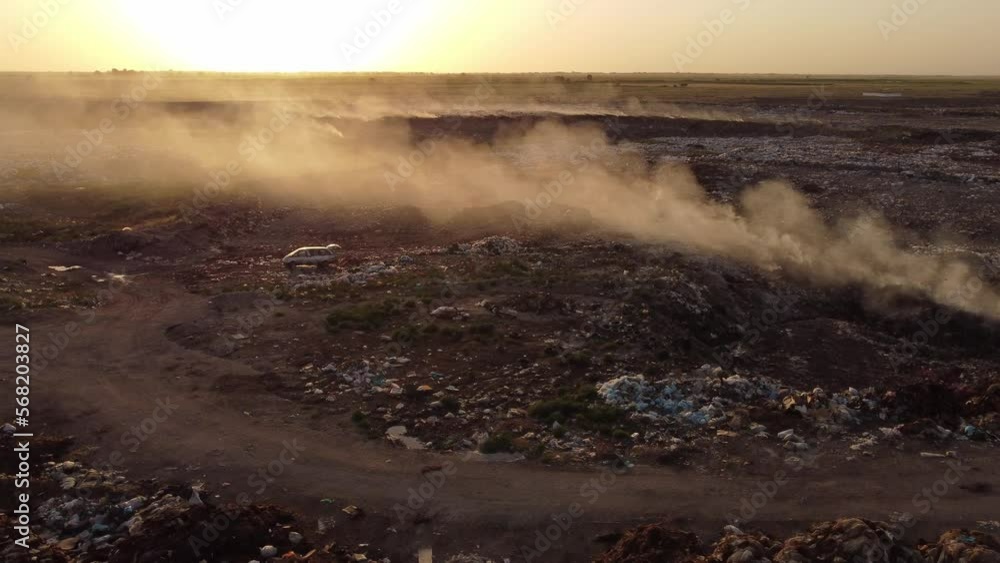 aerial video of a deep-seated landfill fire burning. heatwaves, climate ...