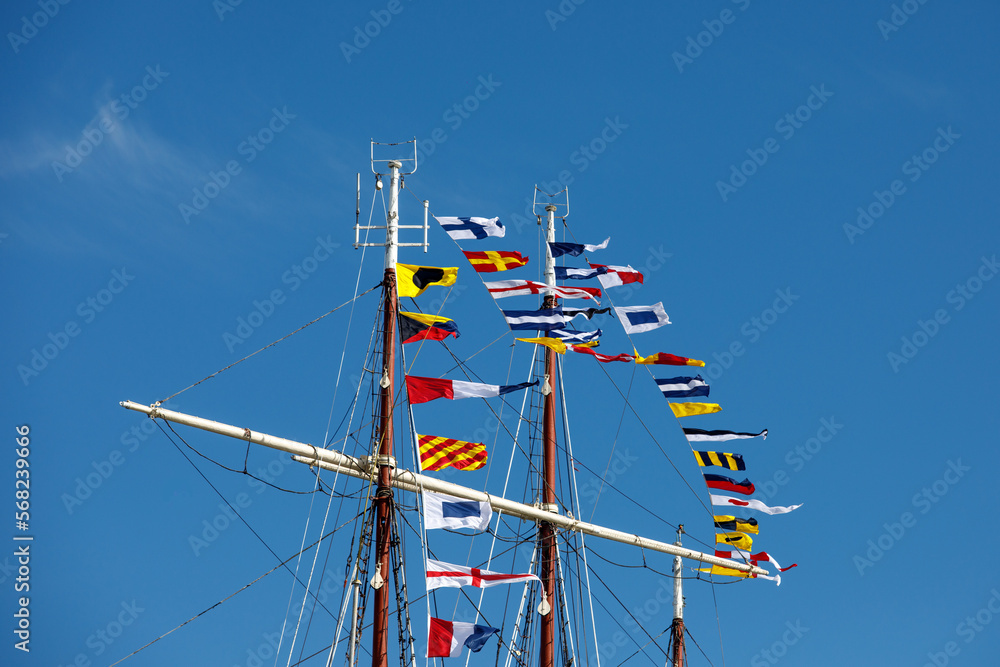 International maritime signal flags on a flagpole and masts on a ...