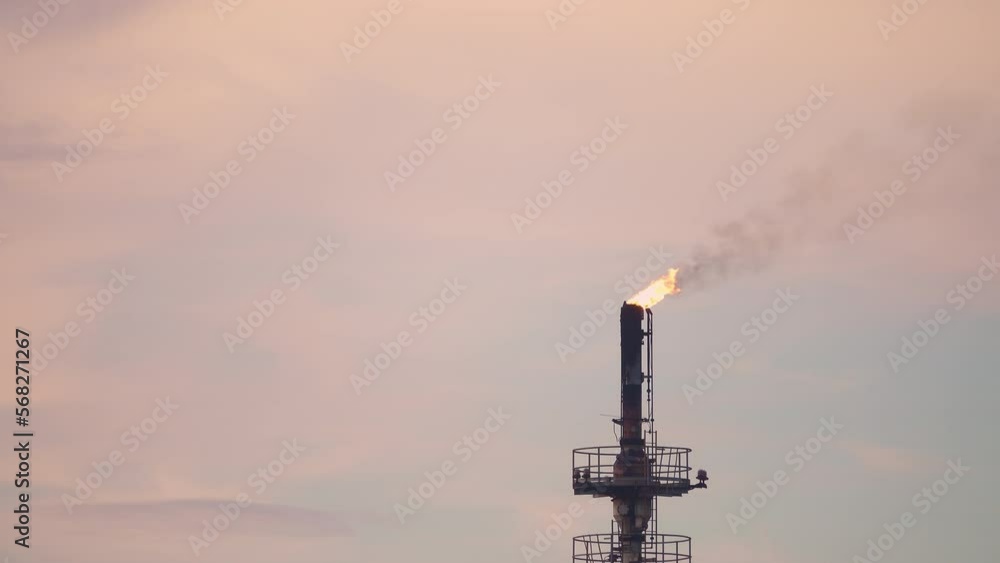 Footage B Roll A Fire on flare stack at refinery oil and gas central ...