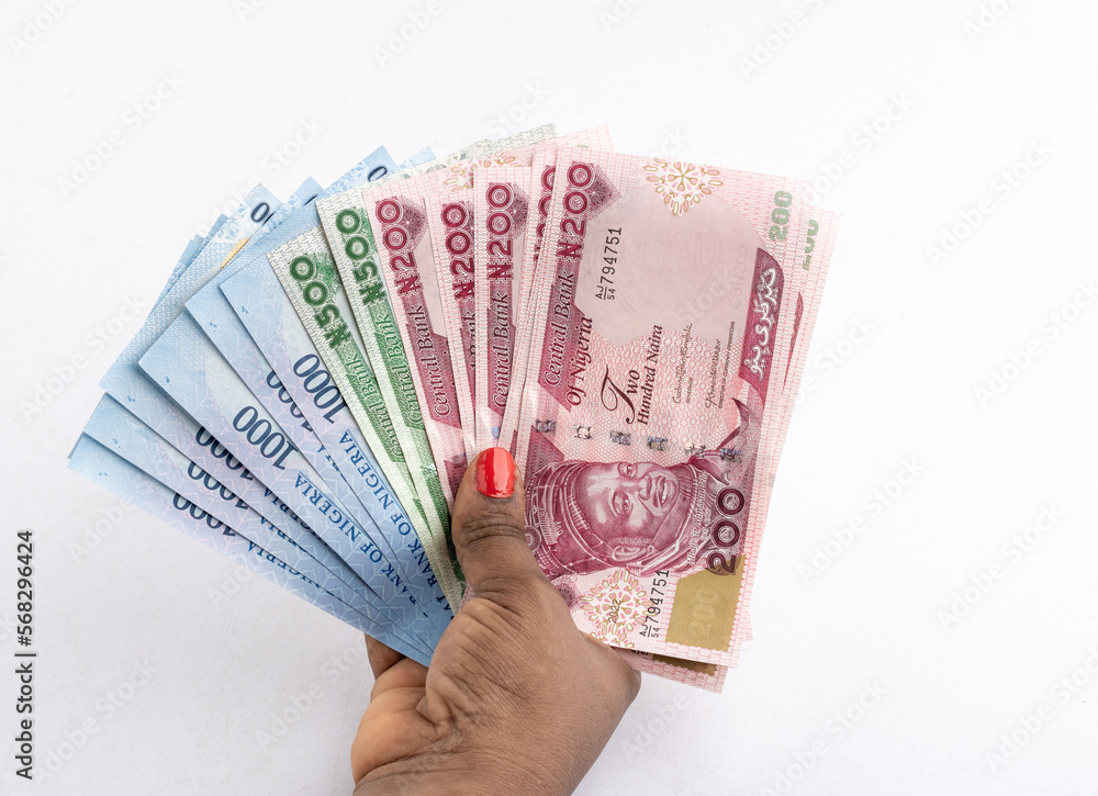 Black Female hand holding the (New) Nigerian currency banknotes , the ...
