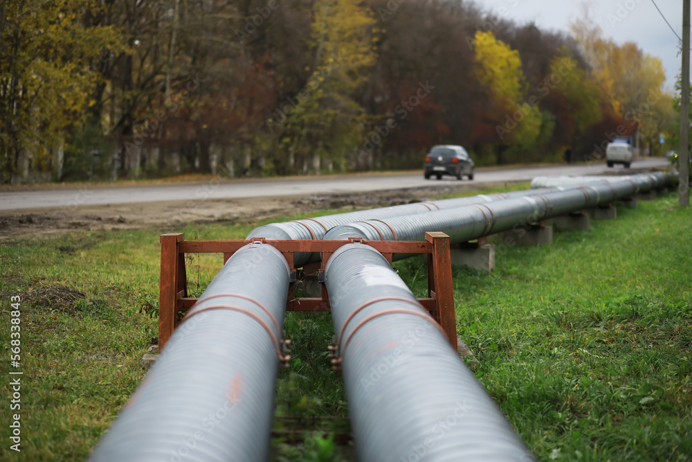Metal pipes on the street. pipes from the pipeline. gas pipeline for ...