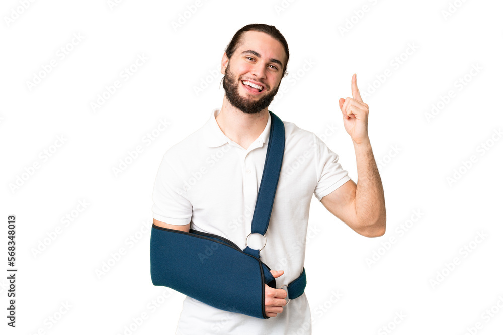 Young handsome man with broken arm and wearing a sling over isolated ...