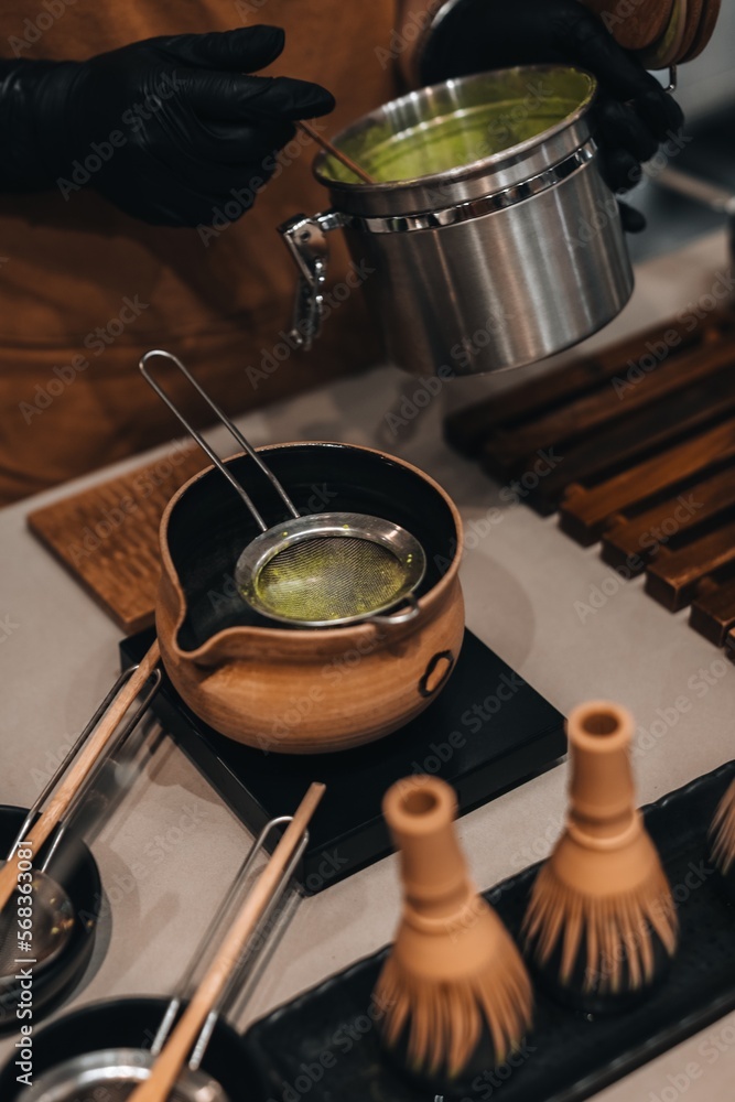 Foto de Matcha green tea making process. Still life with organic ...