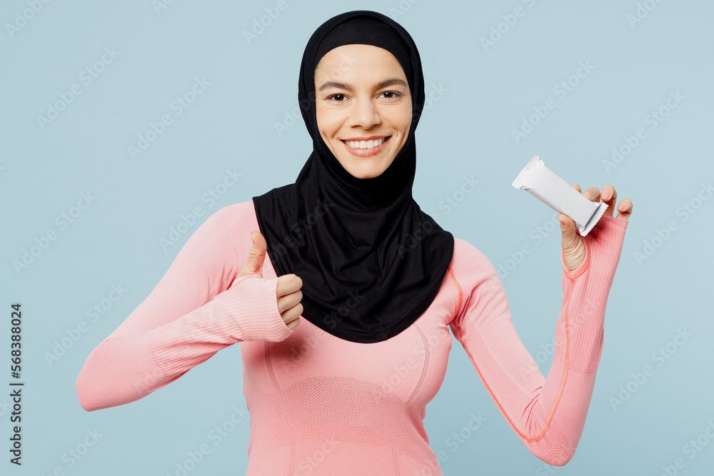 Young arabian asian muslim fitness trainer sporty woman wear pink abaya ...