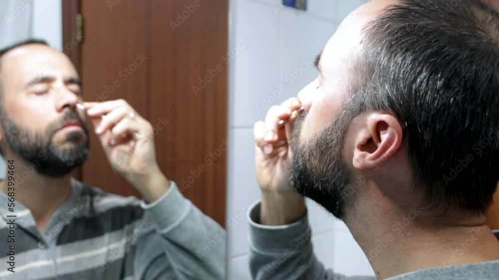 Inserting a swab into the nose for the Covid antigen test at home Stock ...