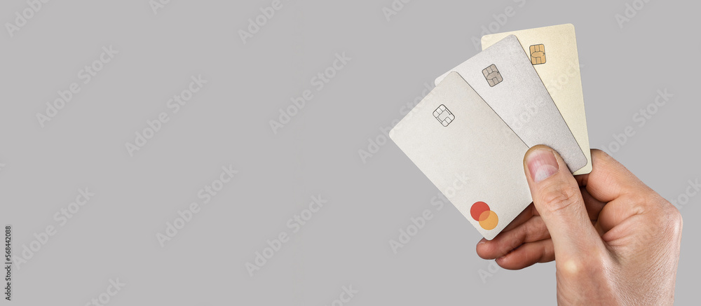 Lodz, Poland February 05 2023 Hand holding plastic bank cards ...