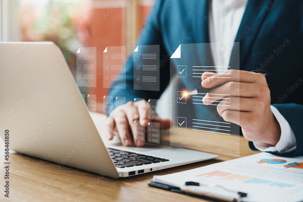 businessman using laptop to do online survey online exam Choosing the ...