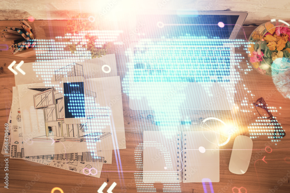 Double exposure of map hologram drawing over study table background ...