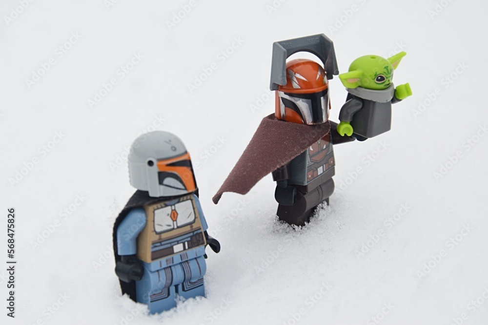 LEGO Star Wars figures of Mandalorians standing in deep winter snow ...