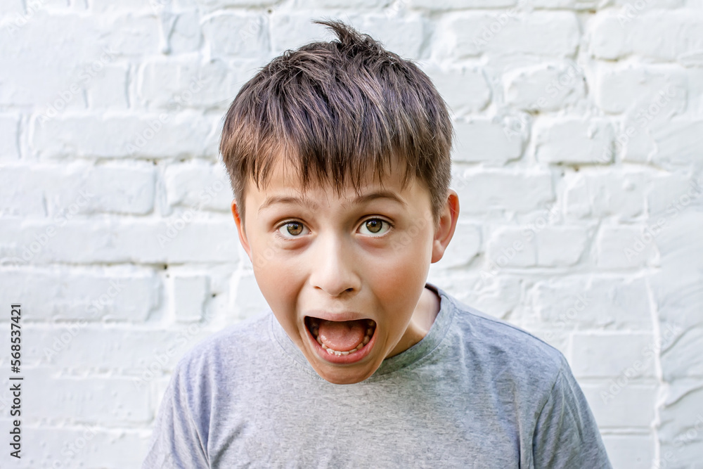 screaming Angry boy teenager with his mouth wide open and with open ...