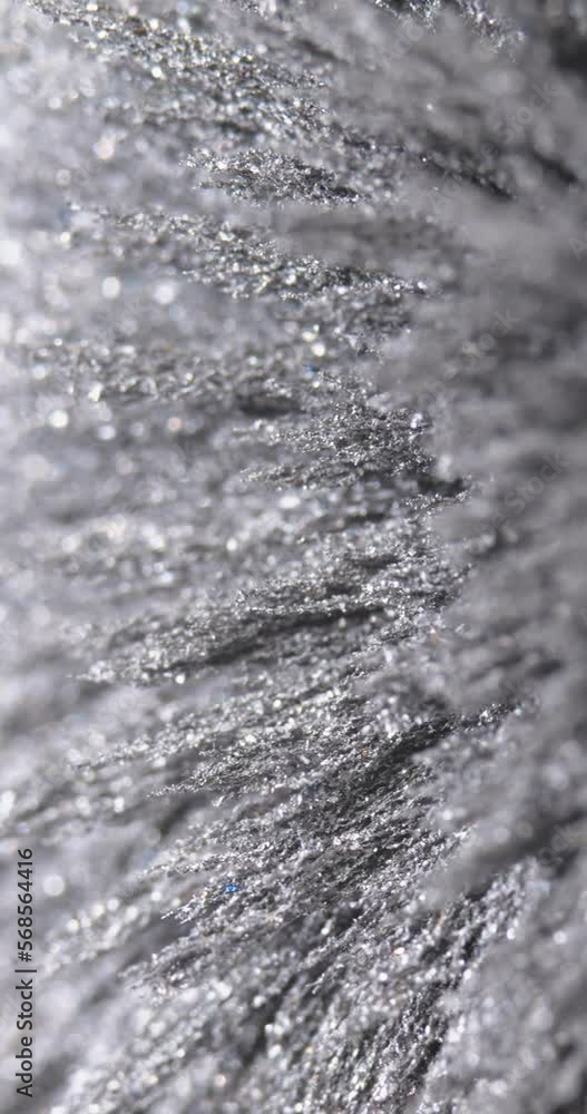 Metal dust, shavings, iron powder under the influence of a magnetic ...