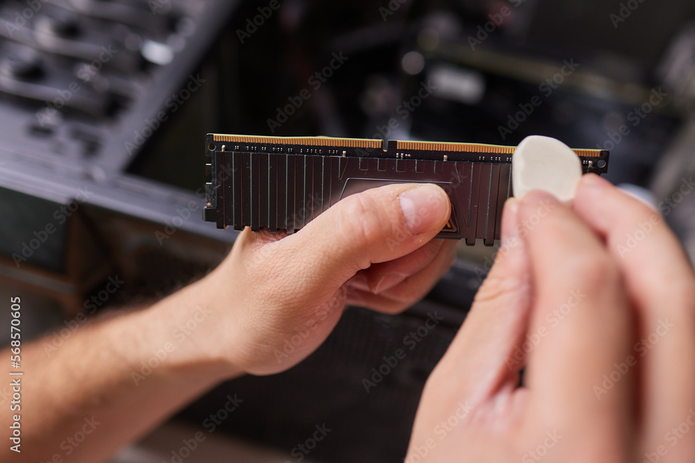 Cleaning a ram contactor using an eraser. Stock Photo | Adobe Stock