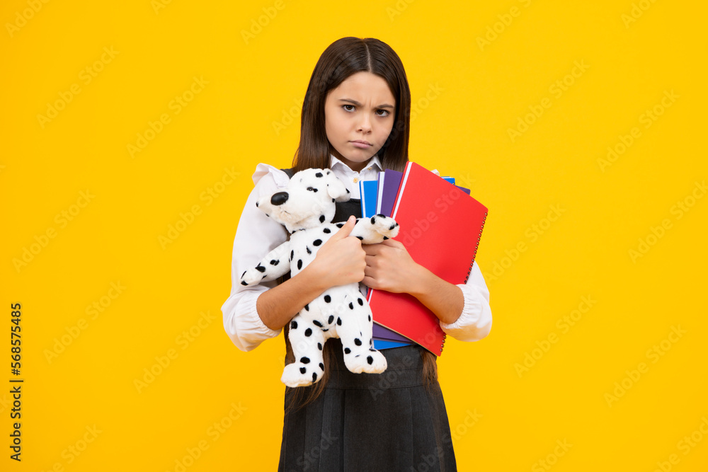 Schoolchild, teenage student girl with toy on isolated studio ...
