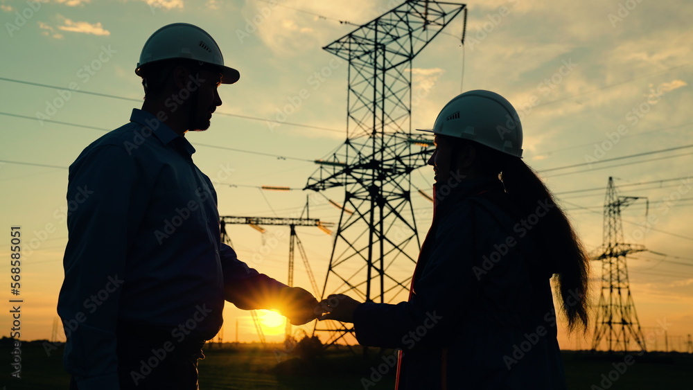 Team of power engineers builders, woman, man, are working together on ...