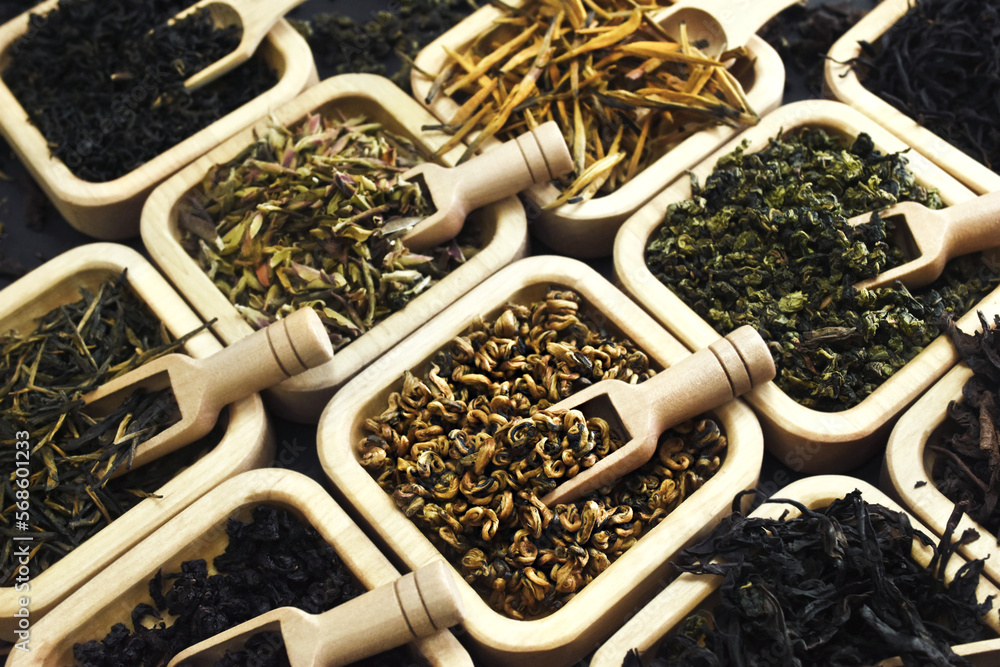 Colorful mix of tea varieties: red and black, green and white, oolong ...