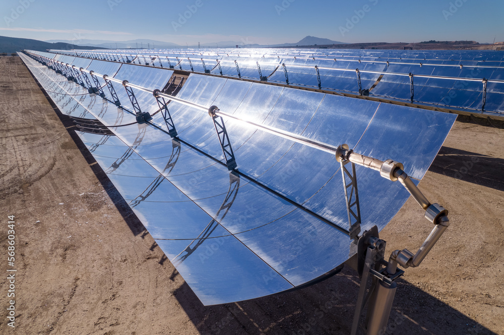 Solar thermal energy (STE) power plant. Mirrors heat water pipes to ...