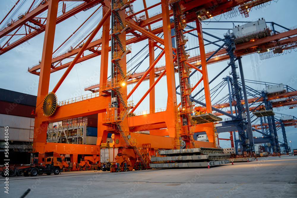 Crane loading cargo container freight container ship in the international terminal logistics sea ...