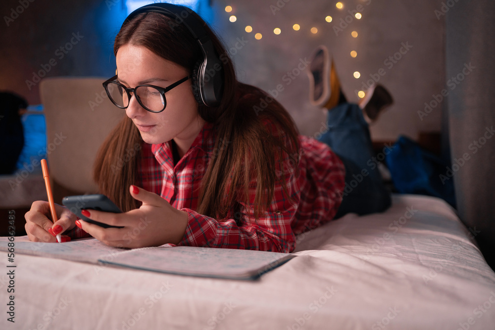 Teen girl student with cell phone for distance learning using mobile ...