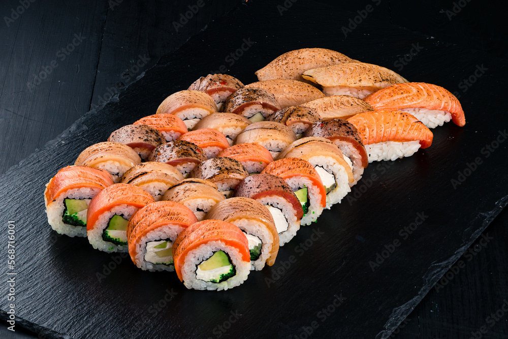 Japanese lunch sushi rolls and nigiri with tuna, salmon, eel, tobiko ...