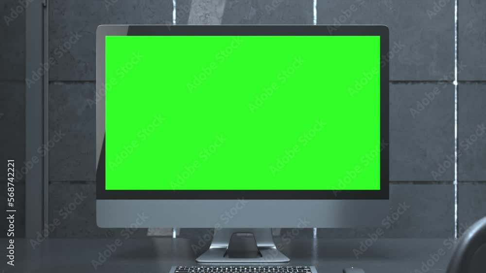 Computer Green screen Mock-Up on work desk in office dark room ...
