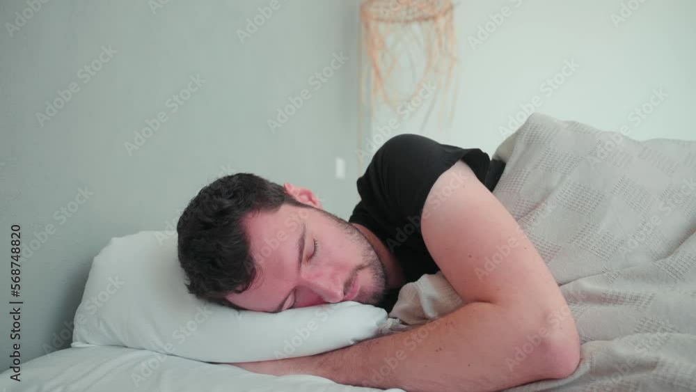 Sleeping man, caucasian white with beard, young man lying in bed ...