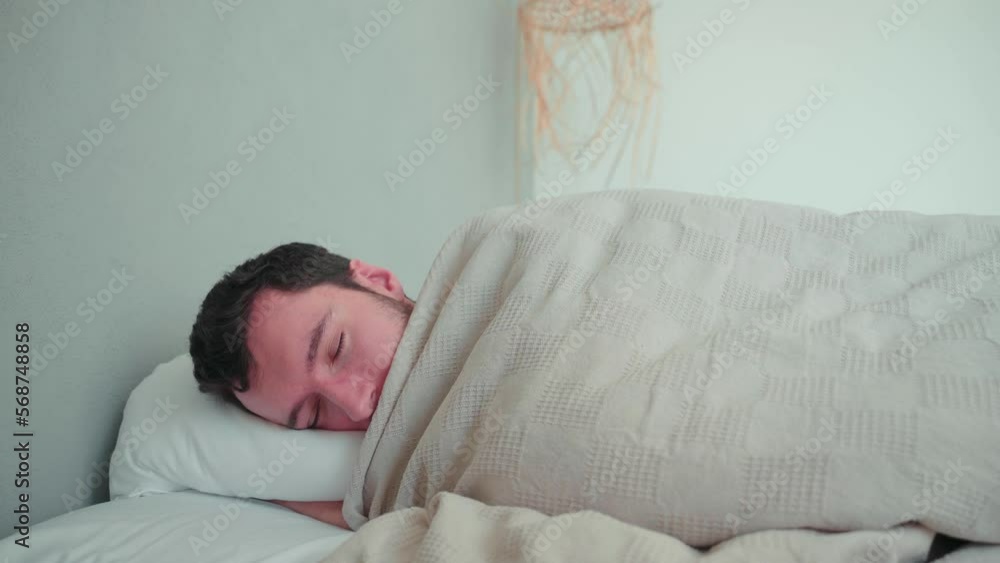 Sleeping man, caucasian white with beard, young man lying in bed ...