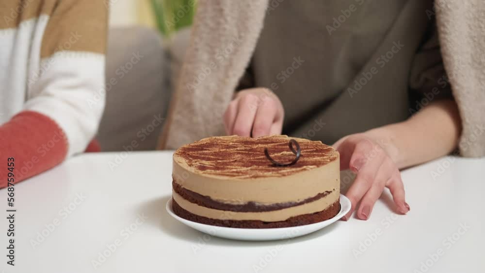 Sweet cake. Pleasant meeting. Friends celebration. Unrecognizable ...