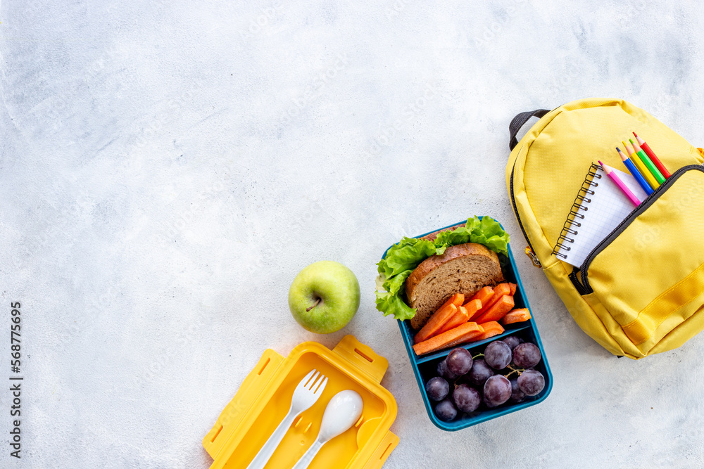 School lunch box with food and backpack, top view Stock Photo | Adobe Stock