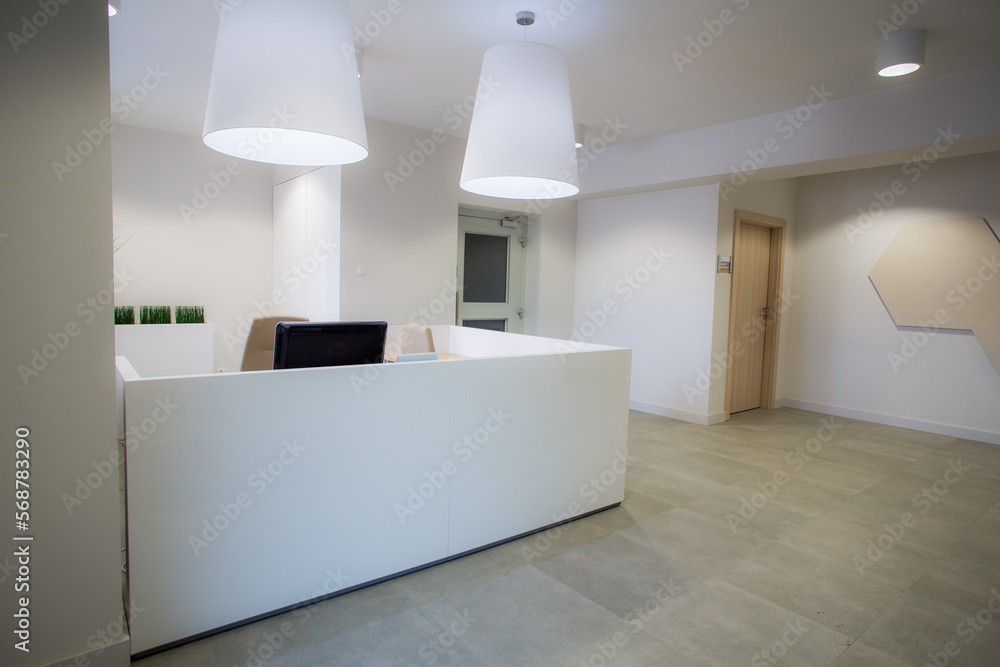 Modern medical reception. White waiting room interior. Receiving ...