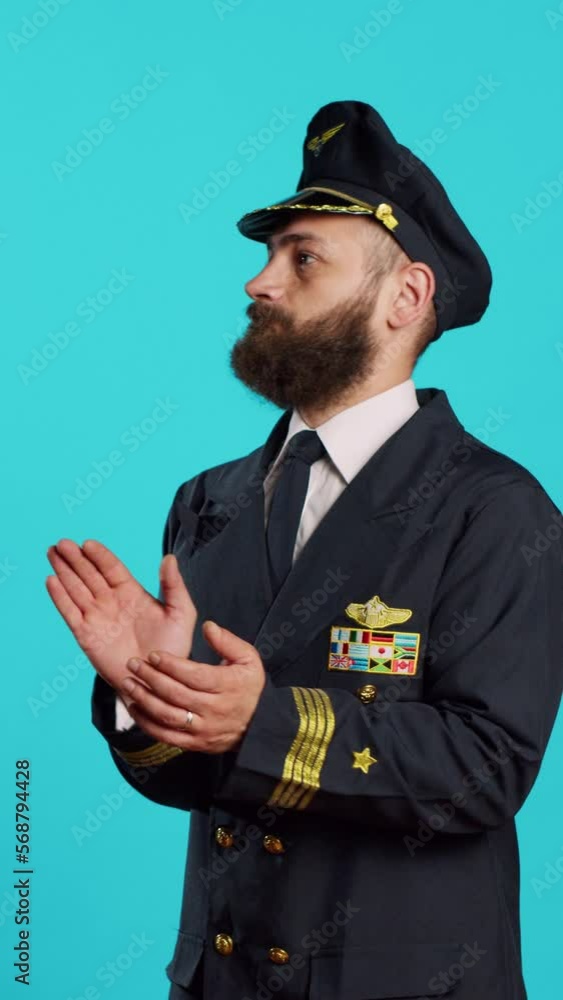 Vertical video: Male aviator applauding and cheering on camera, saying ...