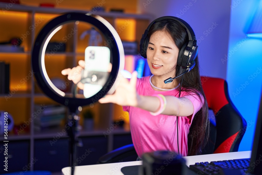 Young chinese woman streamer smiling confident having video call at ...
