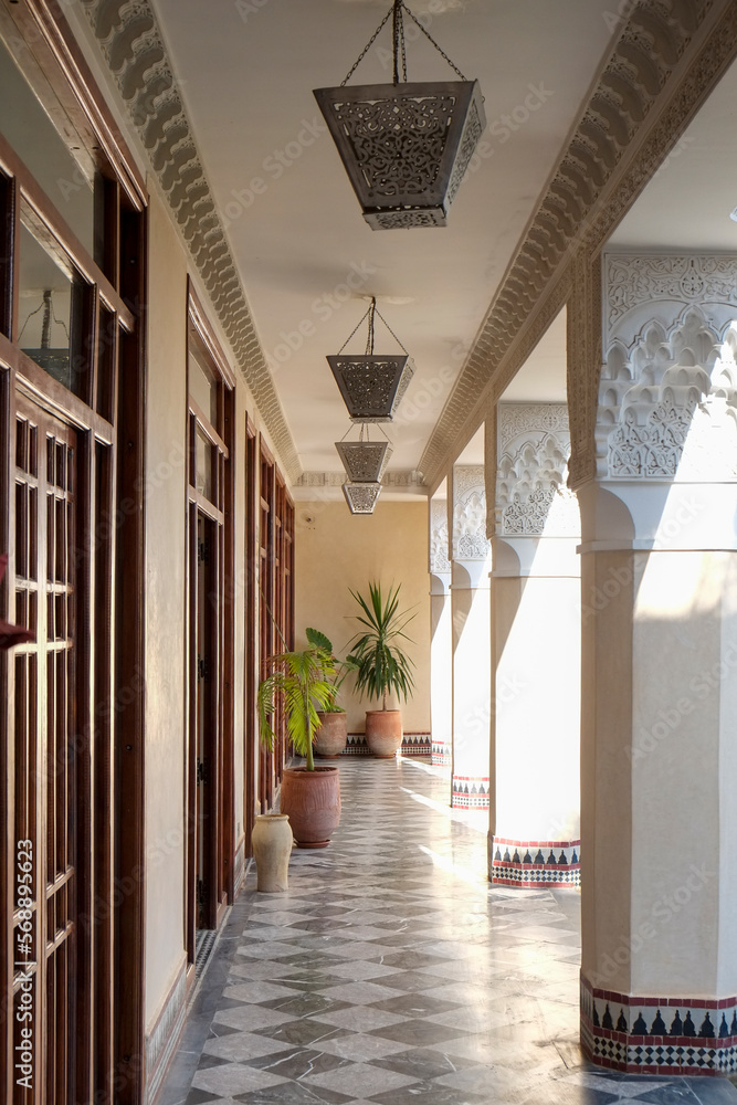 Africa, Morocco, Walkway with Moorish decor at local riad Stock Photo ...