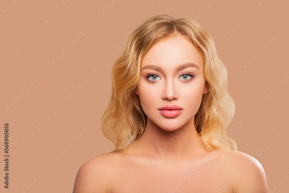 Beauty portrait of a young blonde woman with curly hair and light ...